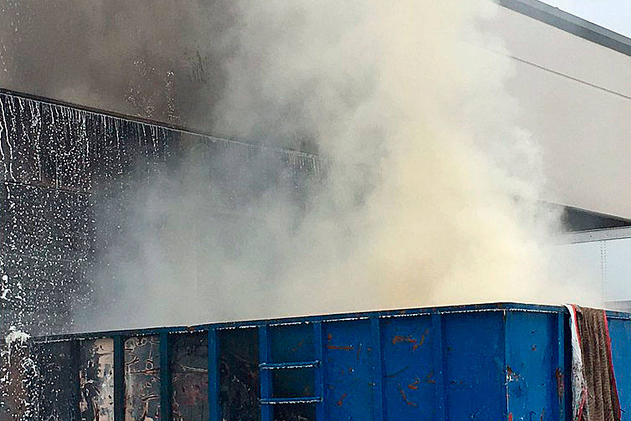 Kent firefighters extinguish dumpster fire next to commerical building ...