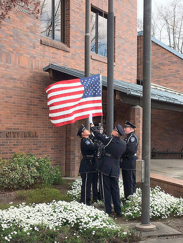 Kent Police Honor Guard flies flag for detective Focht | Kent Reporter