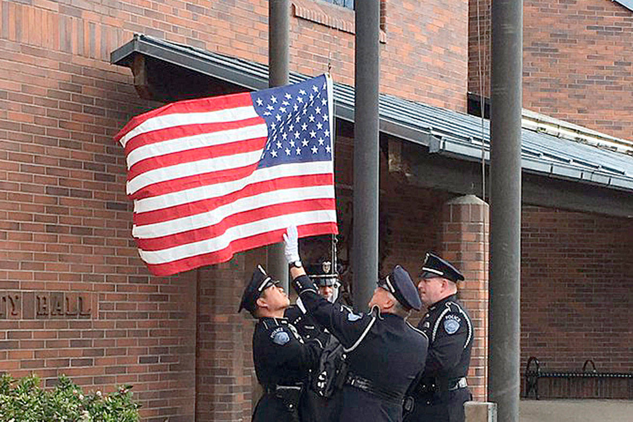 Kent Police Honor Guard flies flag for detective Focht | Kent Reporter