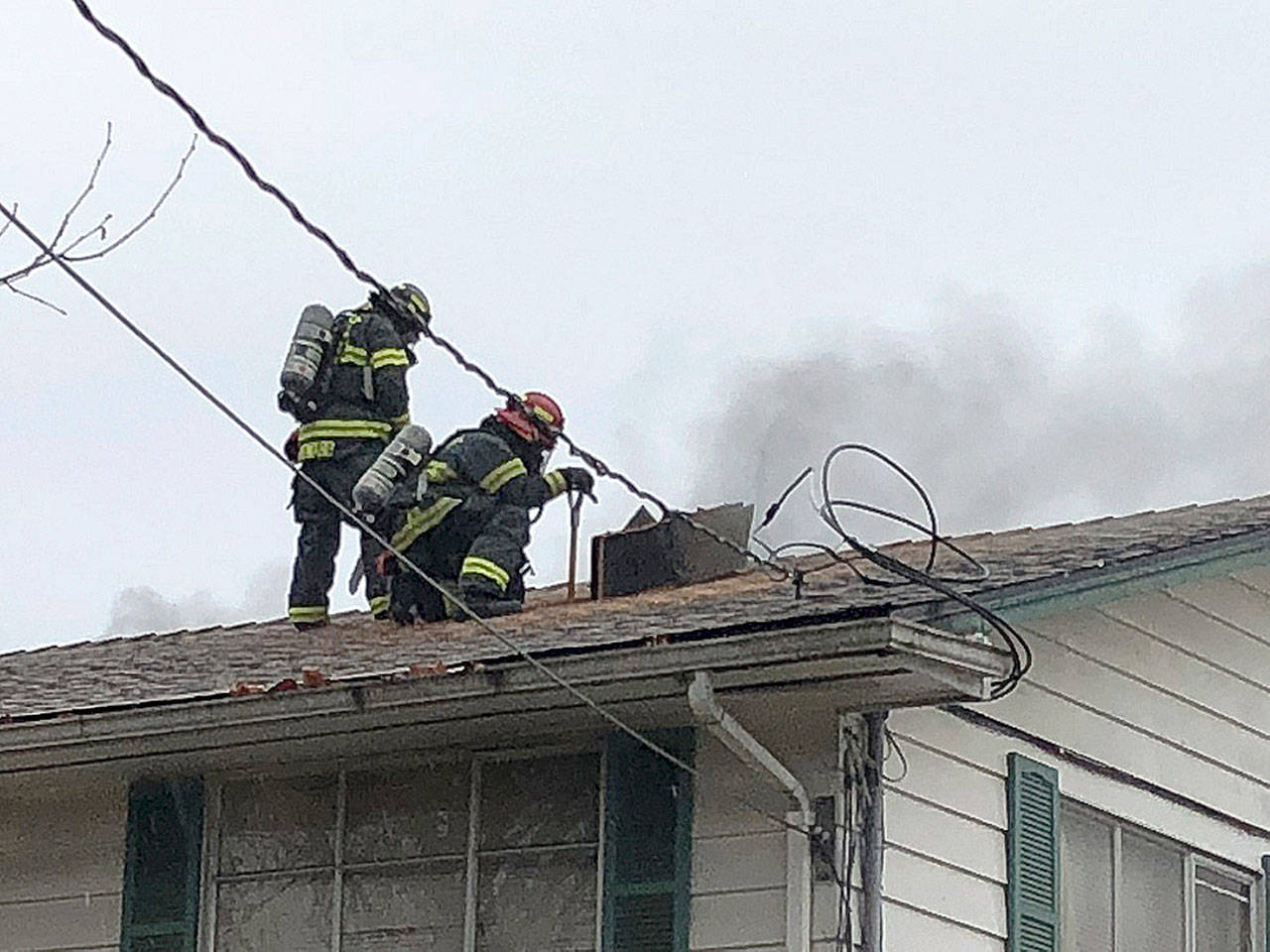 Firefighters rescue woman from Kent house fire | Kent Reporter